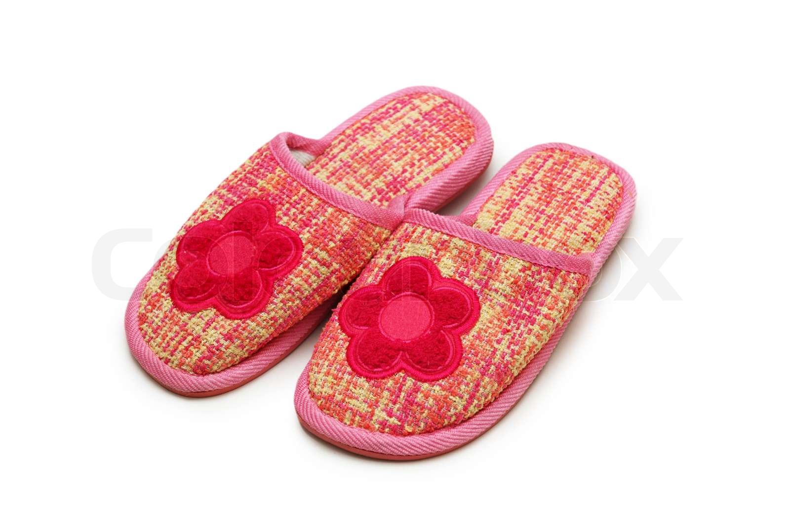 Pair of pink slippers isolated on white | Stock image | Colourbox