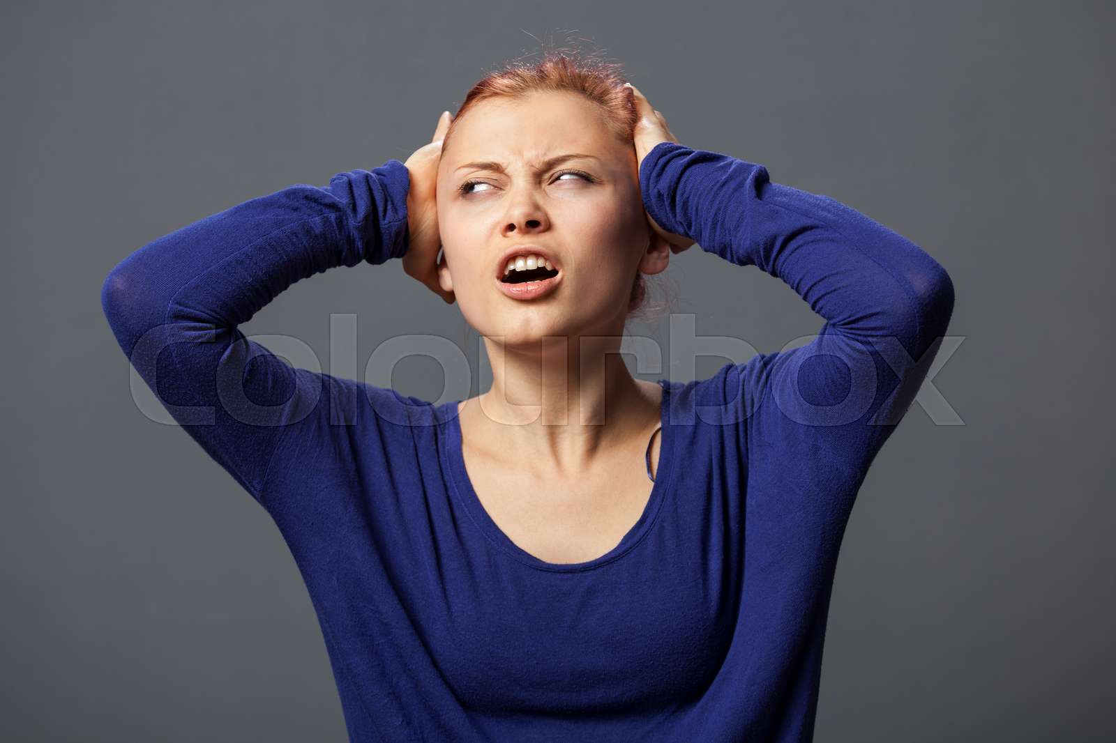 Young woman tormented by headache | Stock image | Colourbox