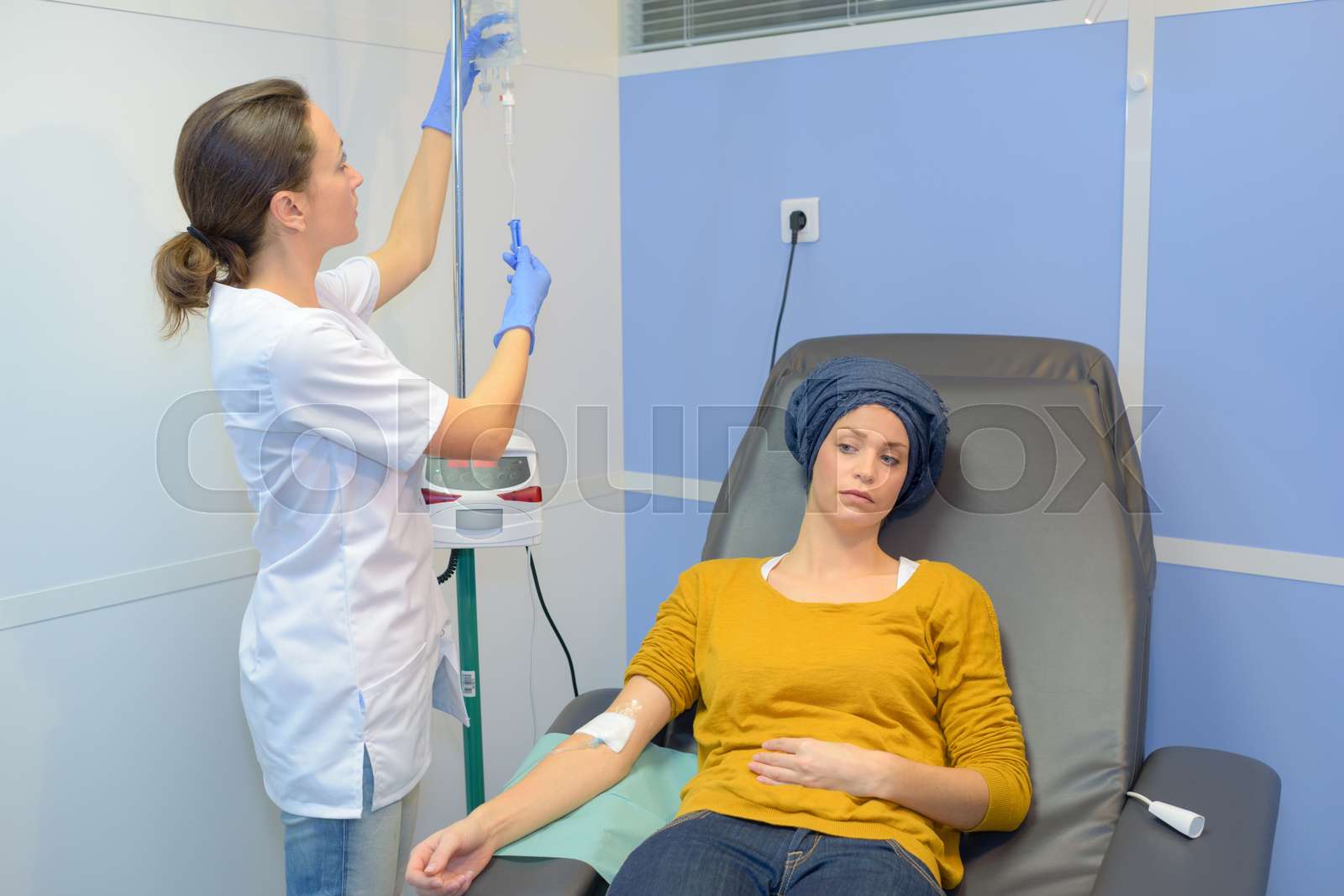 Nurse attending to drip during chemotherapy session | Stock image ...