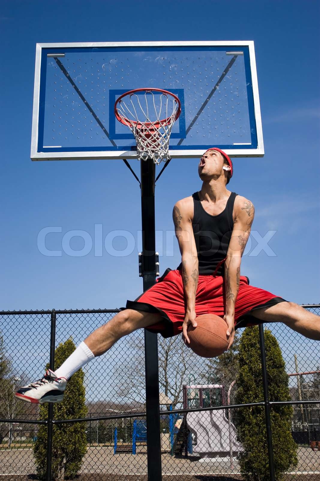 A young basketball player driving to the hoop | Stock image | Colourbox