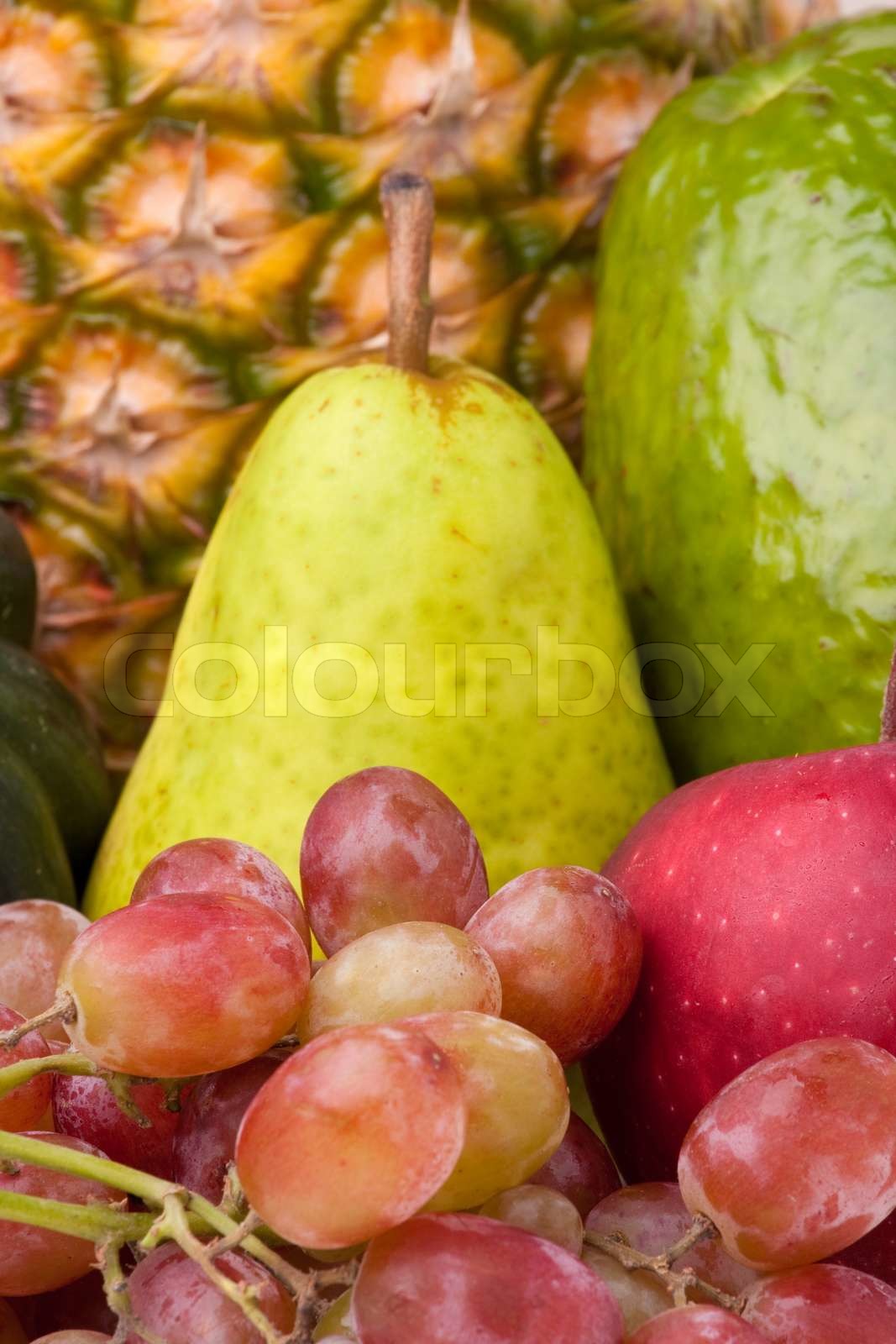 Closeup of a group of arranged fresh fruits and other produceShallow ...