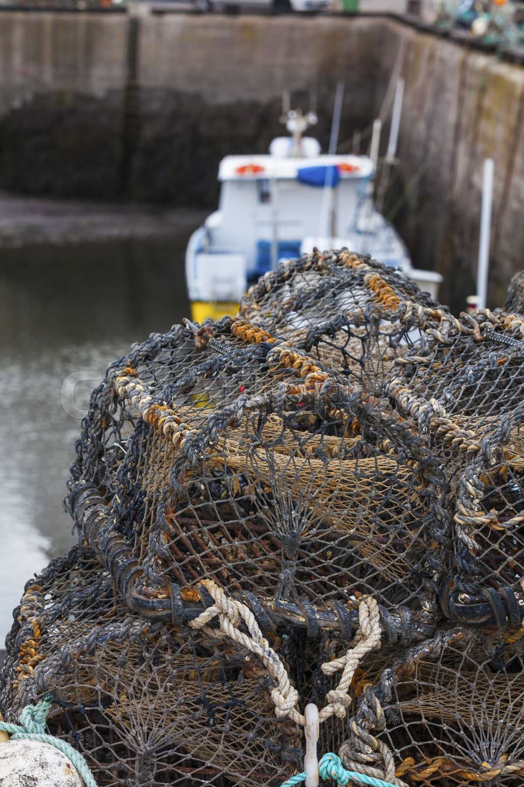 Mesh net shellfish traps at sea port | Stock image | Colourbox