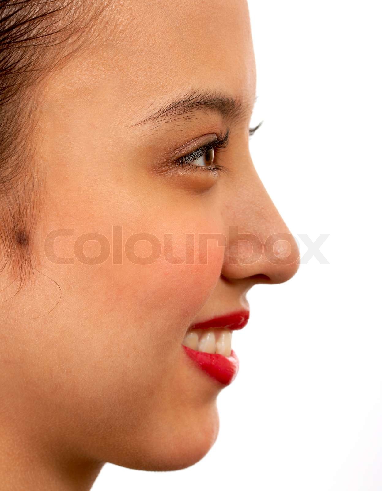 Smukke Pige med dejlig blød hud kigger på noget | Stock foto | Colourbox