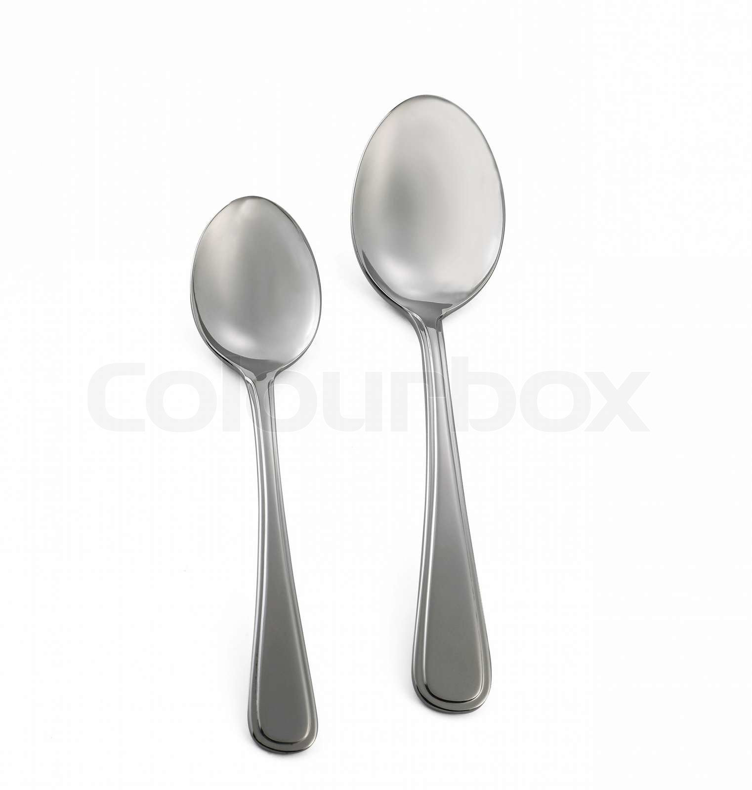 Two small and big spoons | Stock image | Colourbox