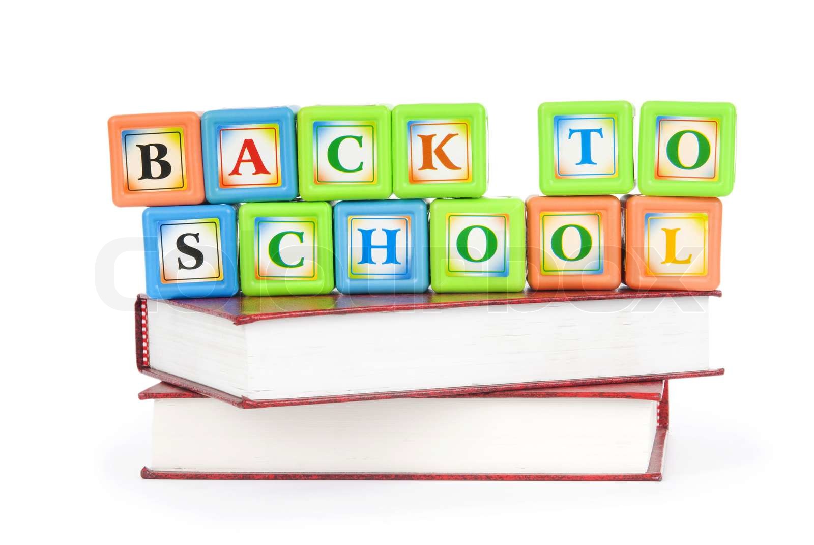 Books and alphabet blocks isolated on white | Stock image | Colourbox