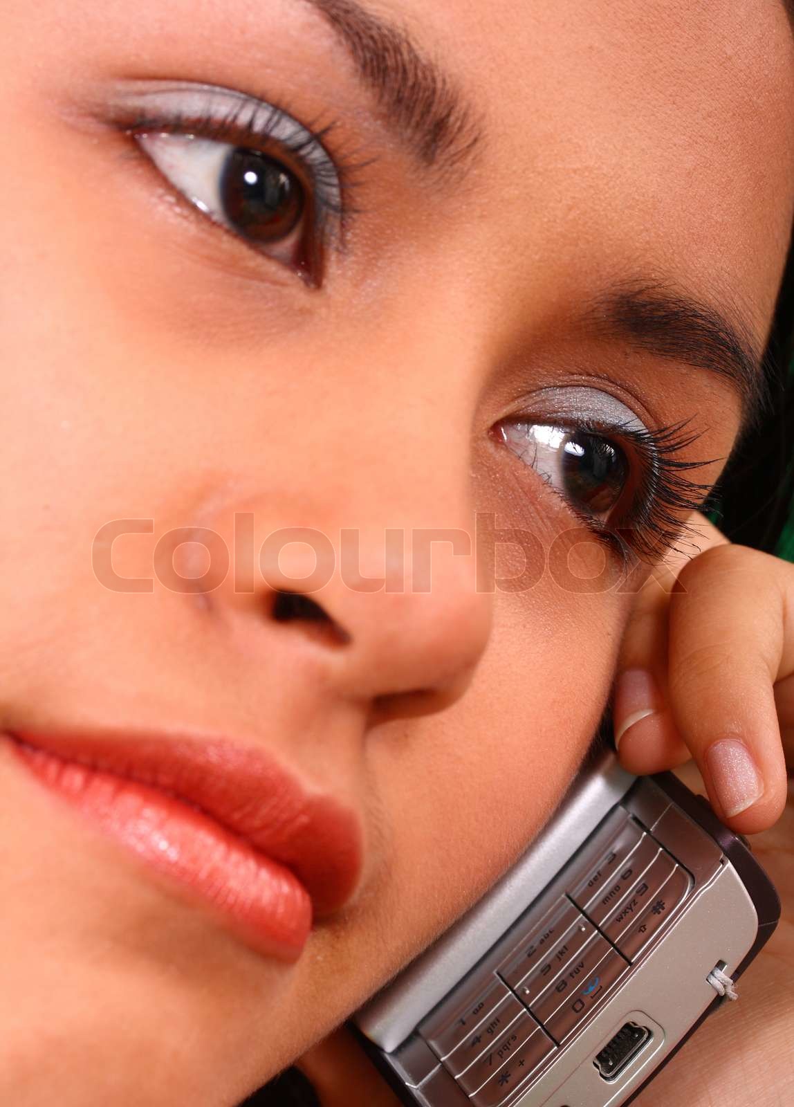 Girl Making A Phone Call To Her Friend Looking Worried And Concerned ...