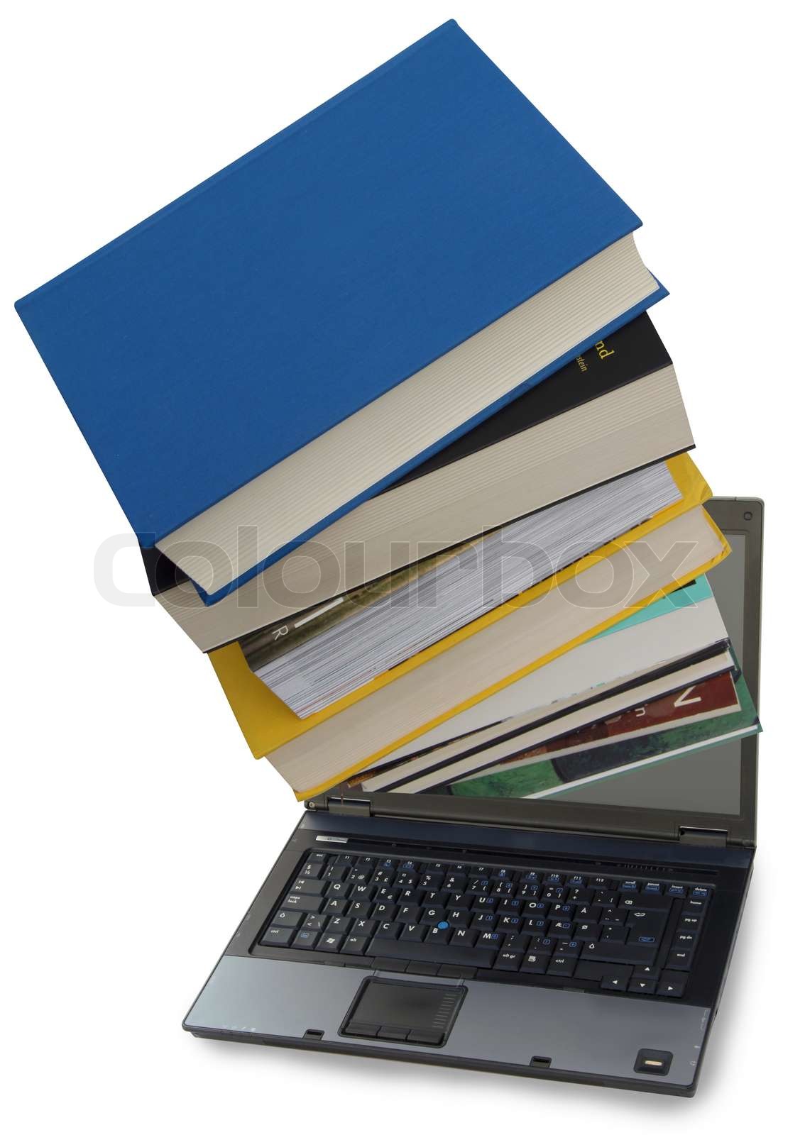 A pile of study books coming out from the screen of a laptop computer ...