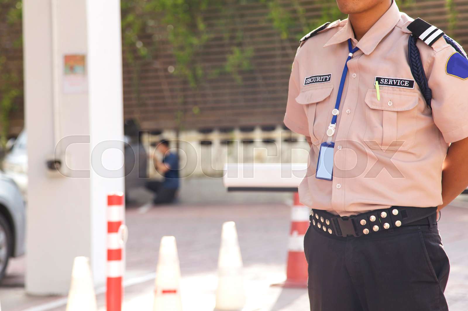 Security guard with opening barrier gate | Stock image | Colourbox