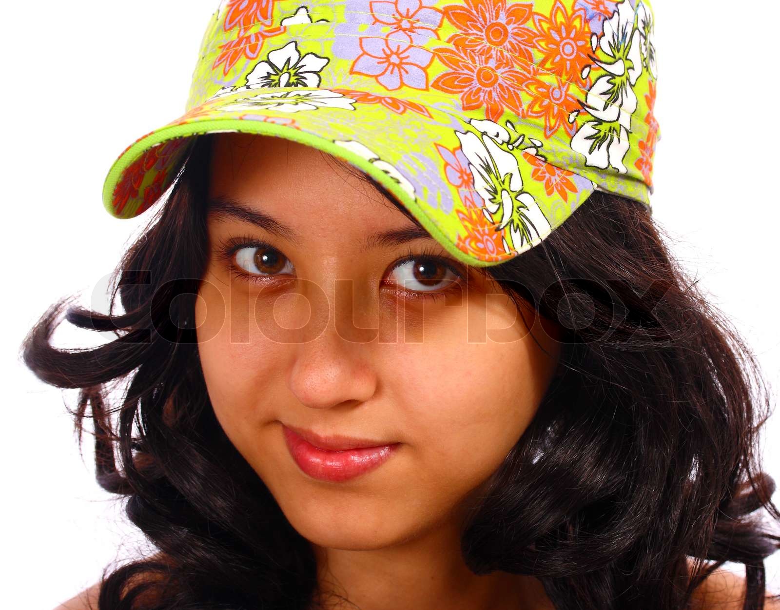 Smiling And Attractive Asian Girl Wearing A Cap | Stock image | Colourbox