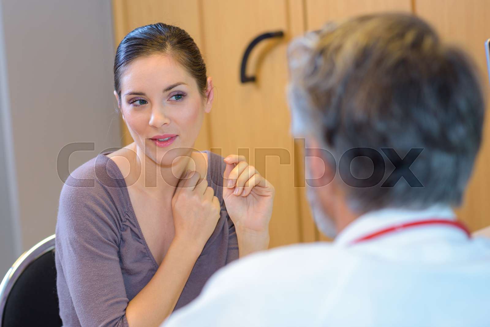Female patient questioning doctor | Stock image | Colourbox