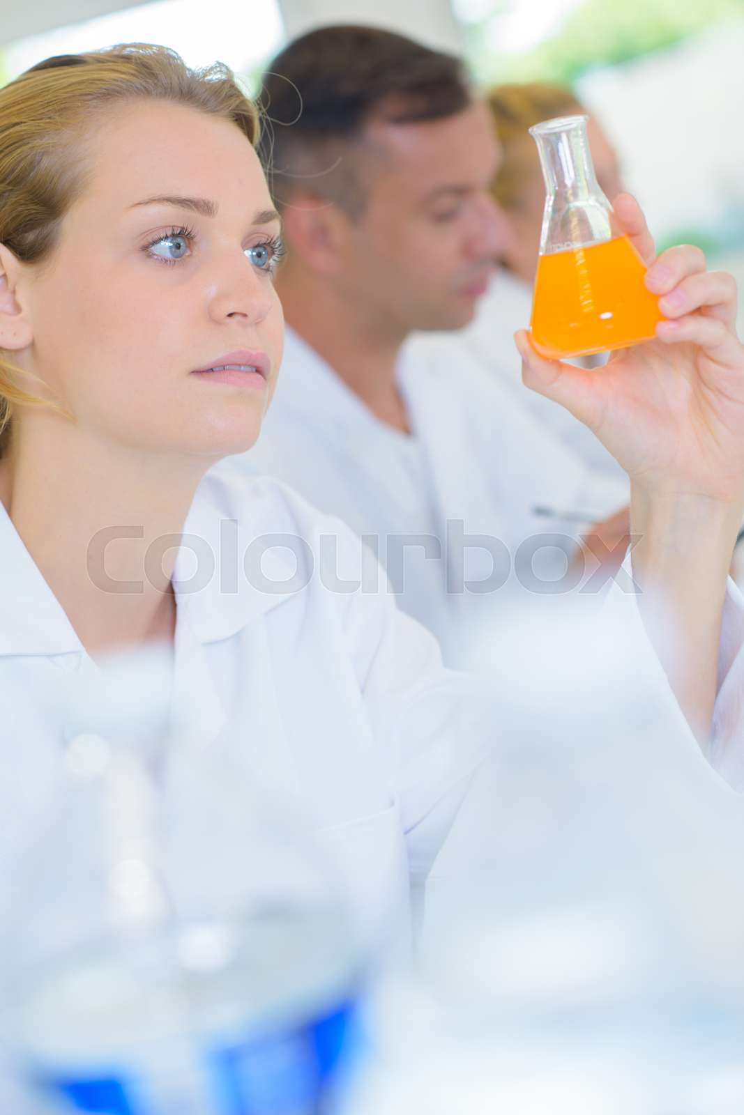orange solution in lab | Stock image | Colourbox