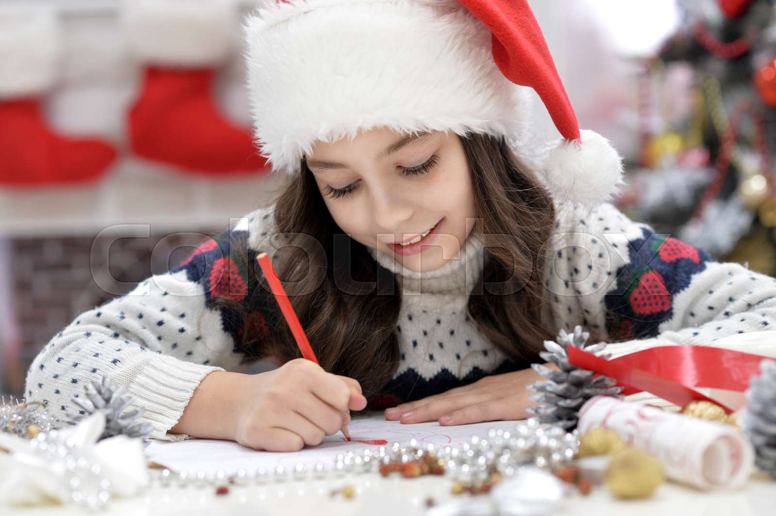 Girl writing letter | Stock image | Colourbox