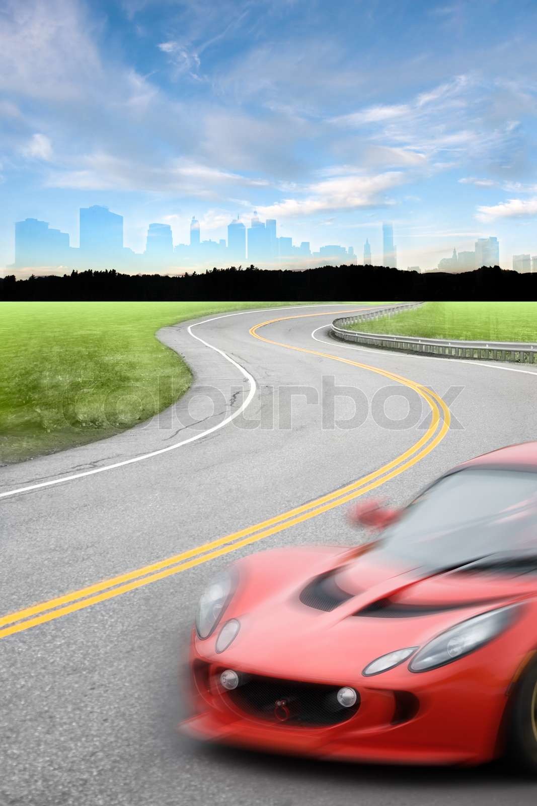 Road scene with a speeding car with motion blur driving down a winding ...