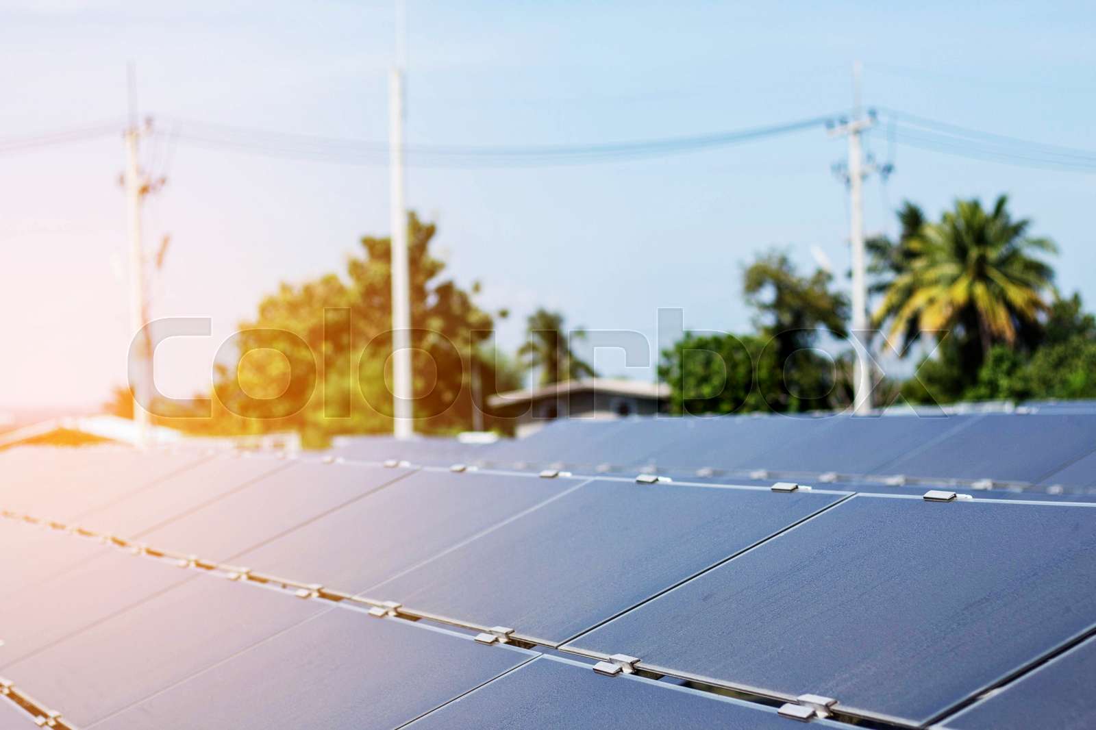 Solar panels with the sun | Stock image | Colourbox