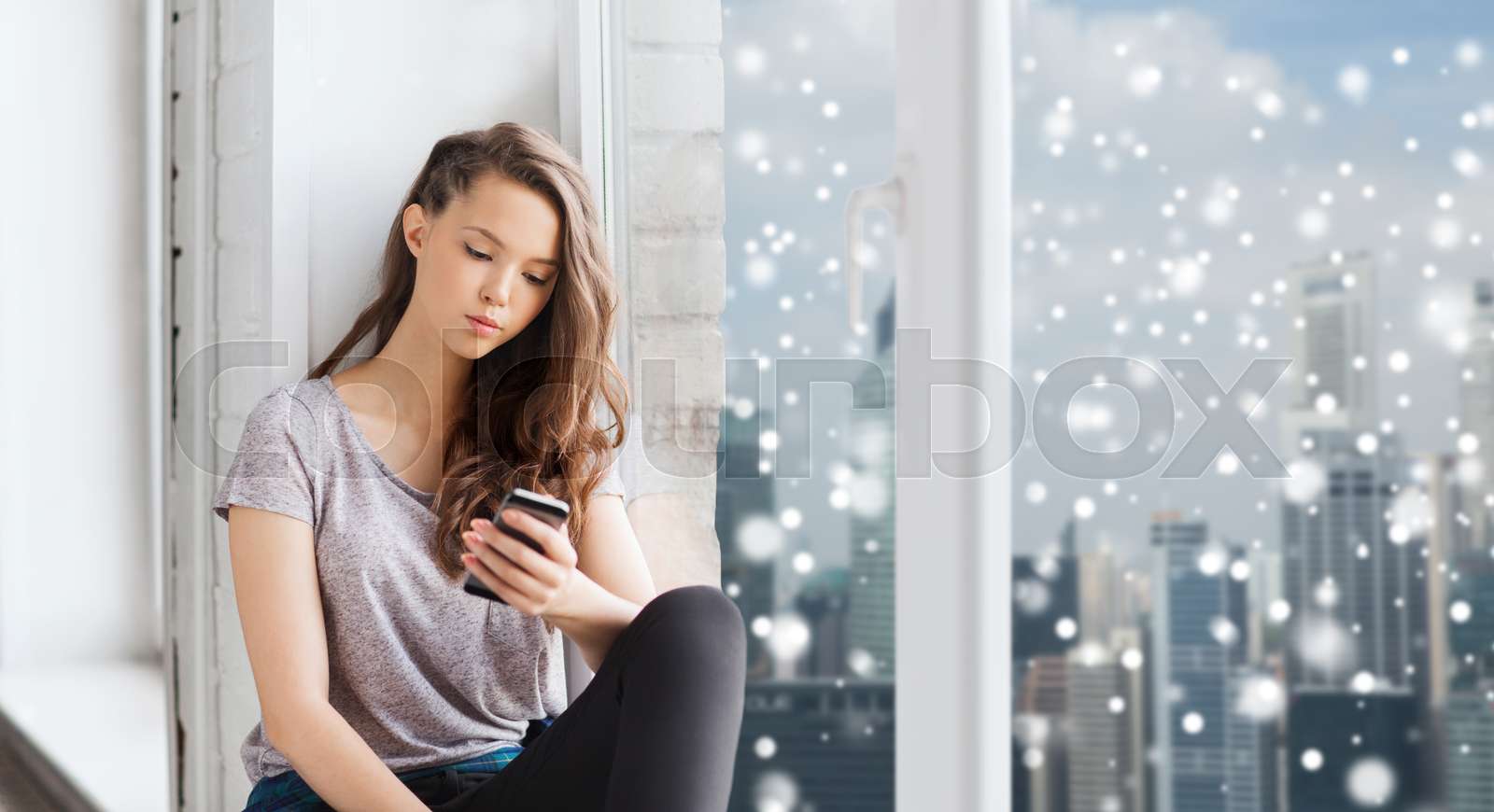 Sad Pretty Teenage Girl With Smartphone Texting Stock Image Colourbox