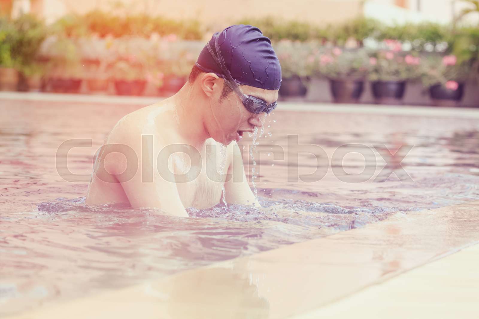 young man finishing swimming training, getting out of pool | Stock ...