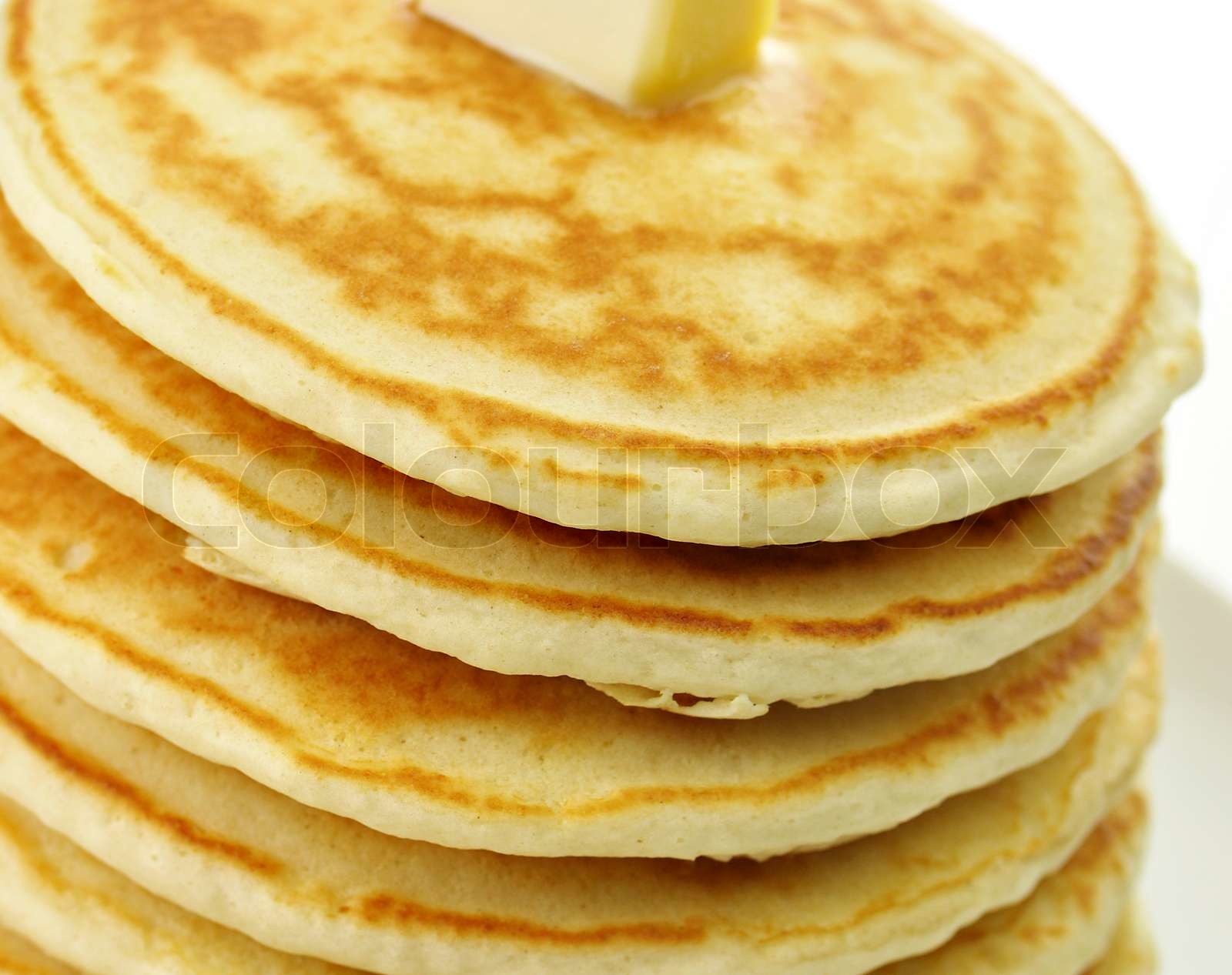 Golden pancakes with butter, close up | Stock image | Colourbox