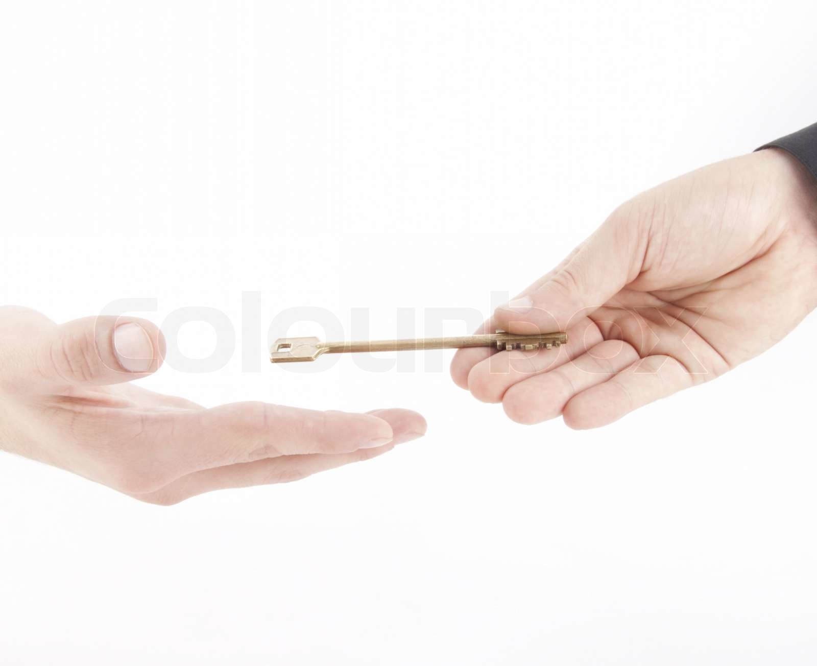one hand giving keys to other isolated | Stock image | Colourbox