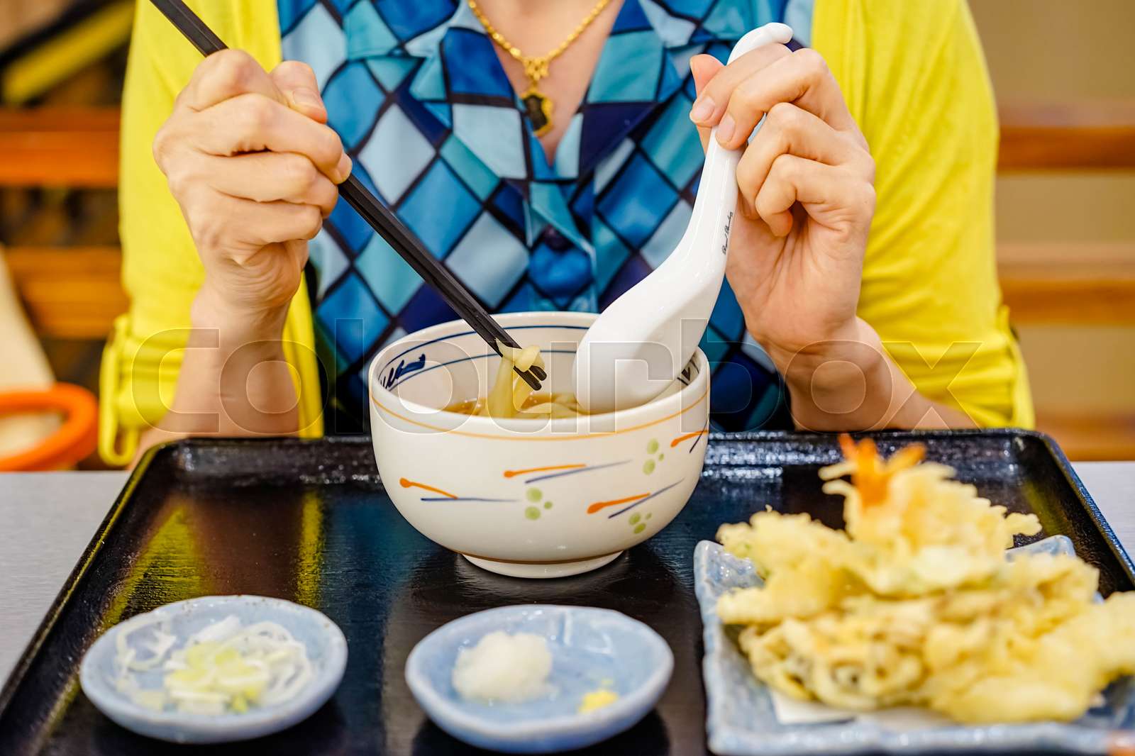 using chopstick eat noodle | Stock image | Colourbox