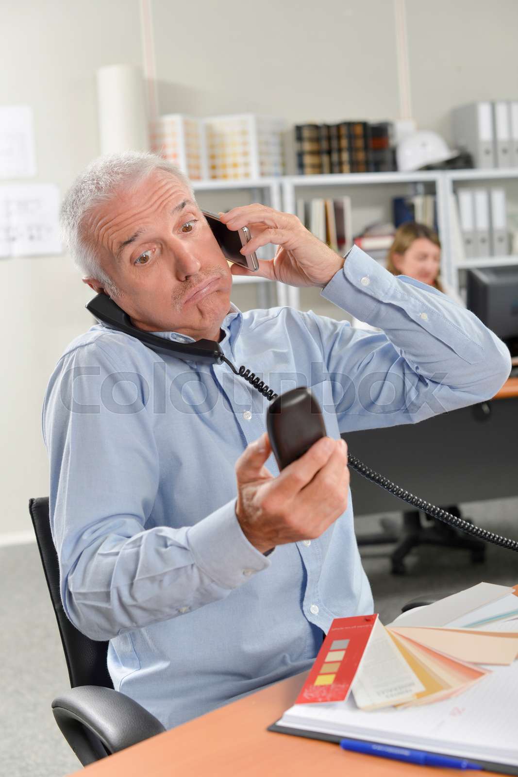 Overworked boss on the phone | Stock image | Colourbox