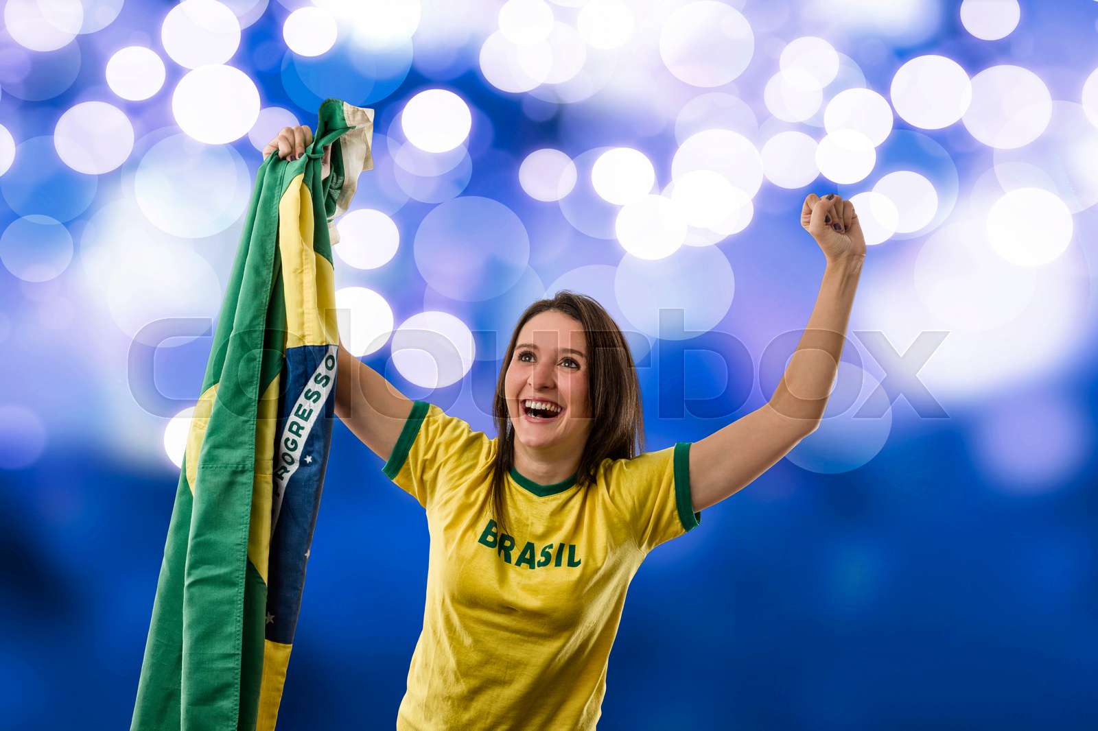 Female Brazilian fan celebrating | Stock image | Colourbox