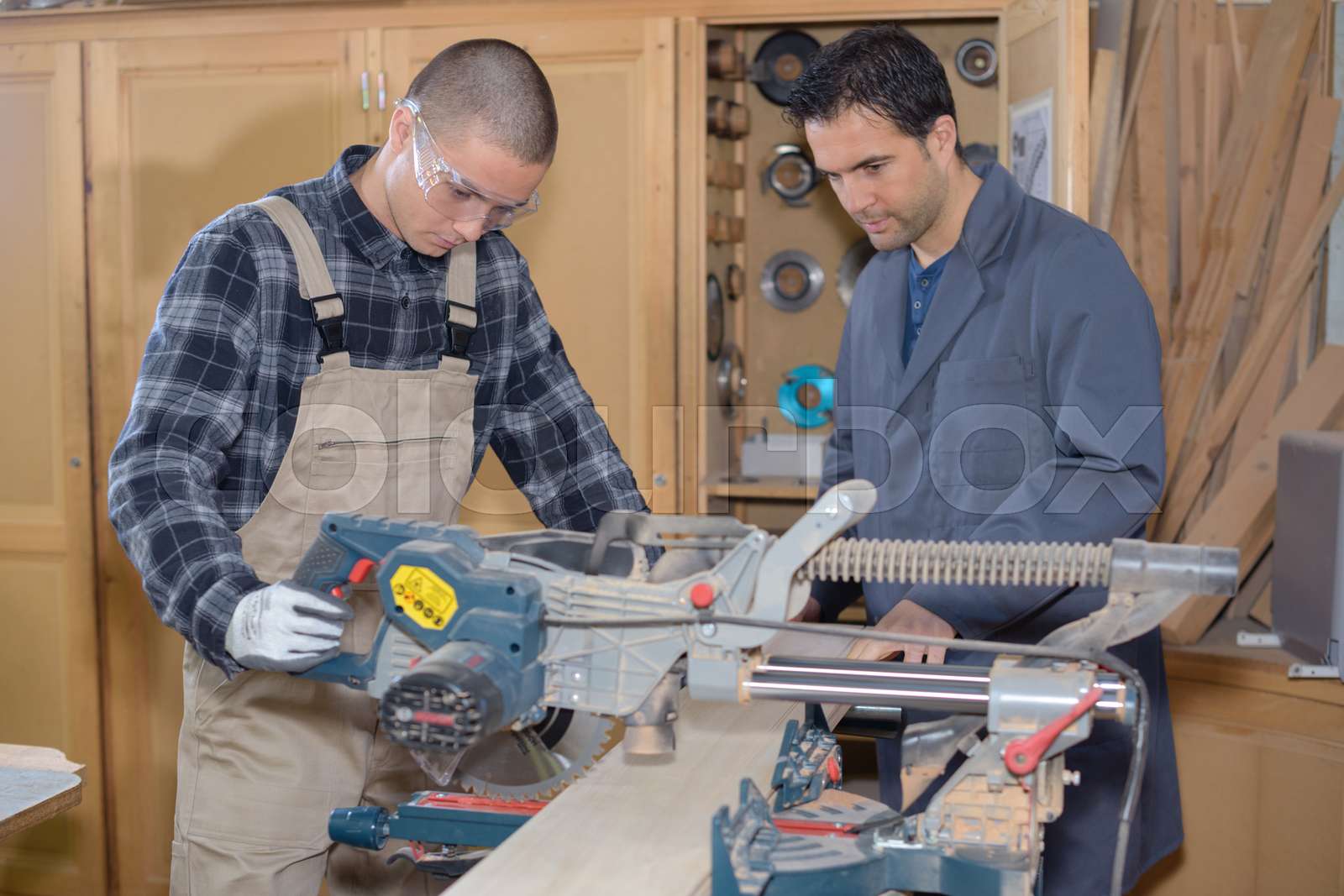 Man using industrial saw | Stock image | Colourbox