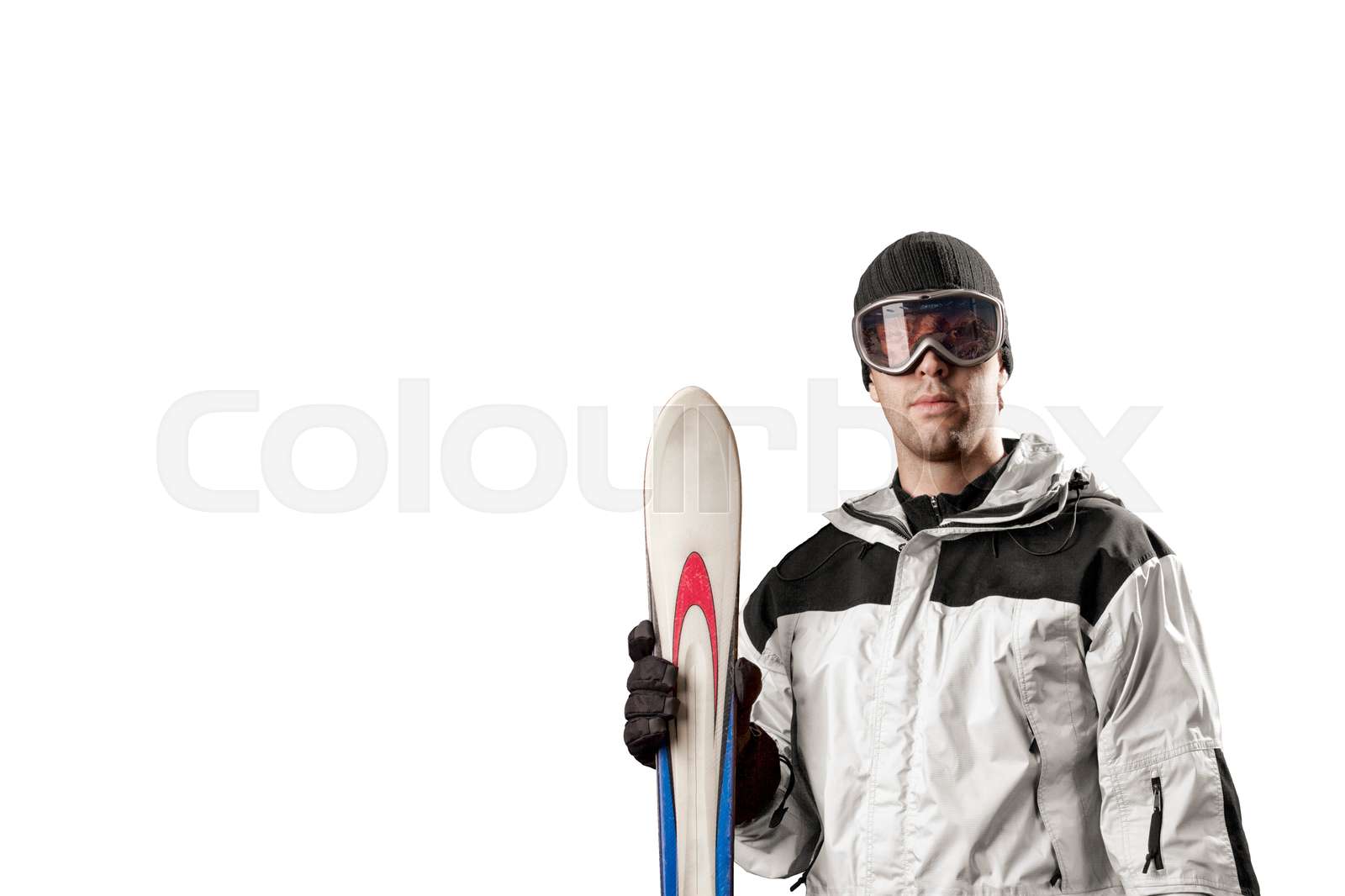 Skier holding a pair of skis | Stock image | Colourbox