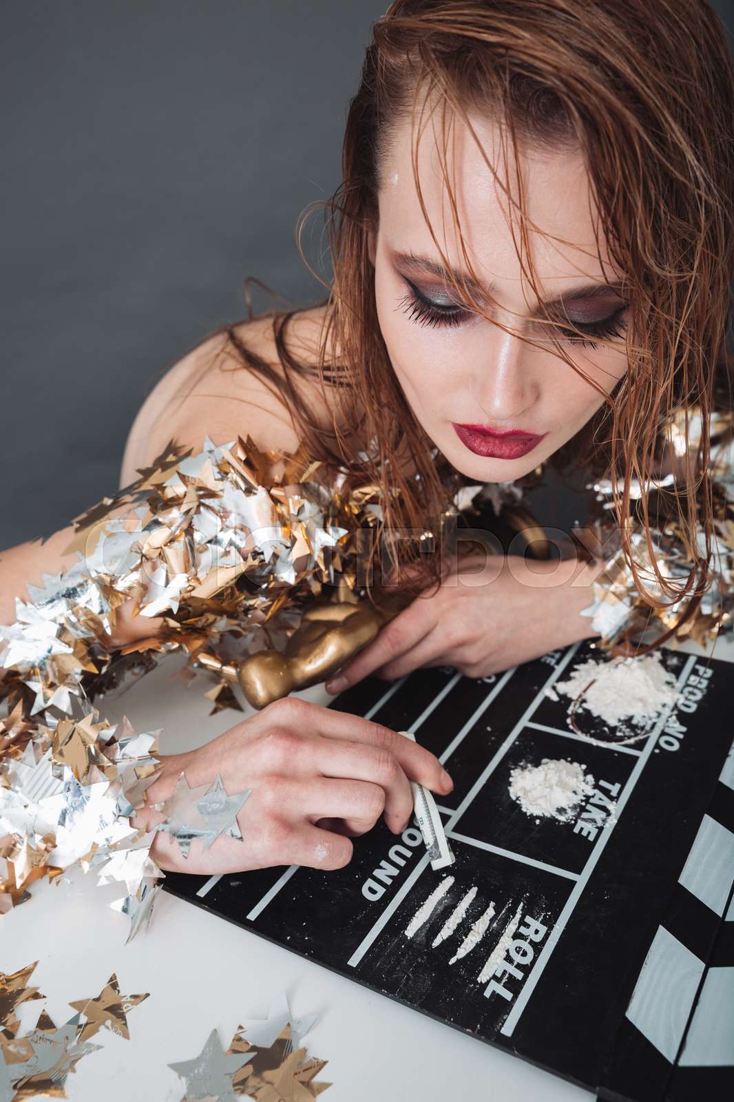 Beautiful addicted woman with stars on her body taking drugs | Stock ...