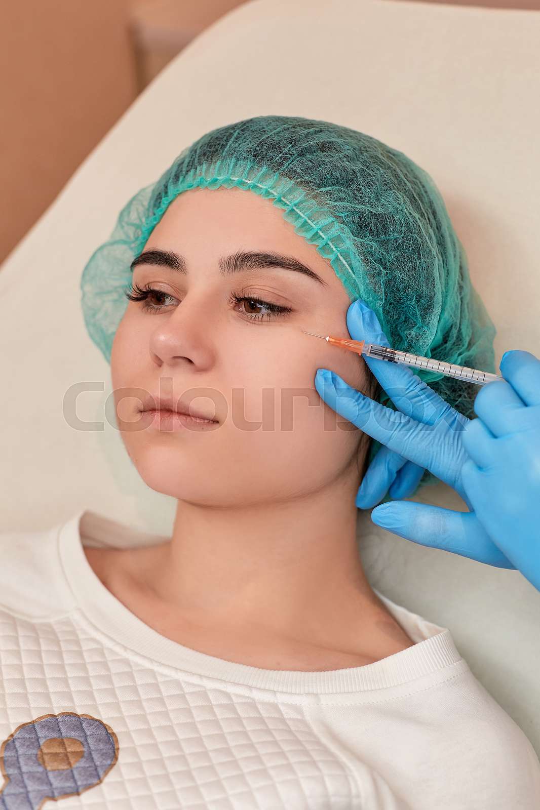 Beautiful woman gets injections. | Stock image | Colourbox
