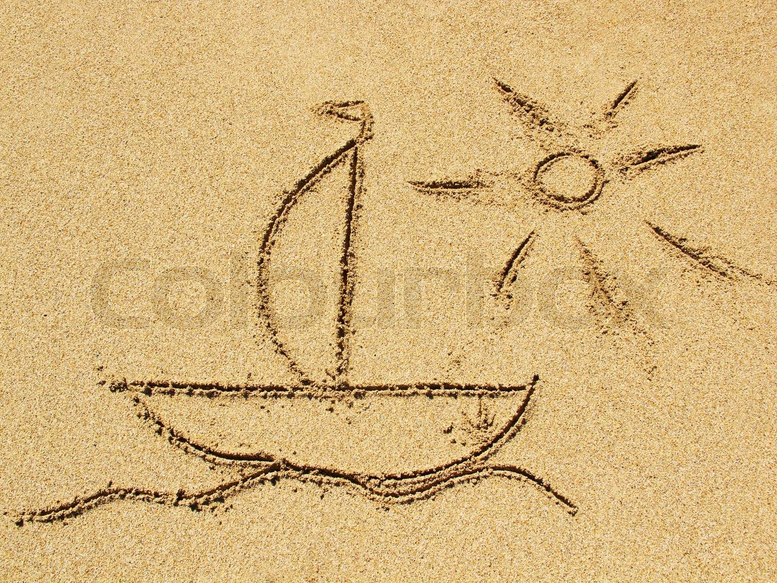 "Ship" drawing on the sand of the beach | Stock image | Colourbox