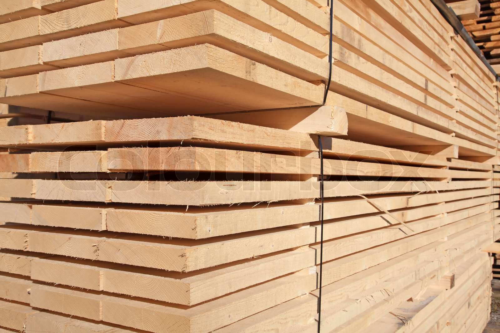 Stack of new wooden studs at the lumber yard | Stock image | Colourbox