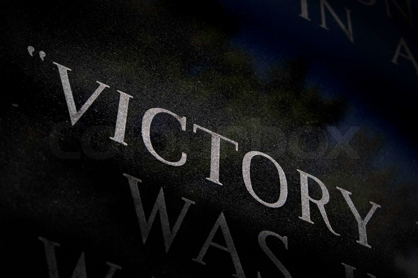 A closeup of the word VICTORY engraved on a war memorial | Stock image ...