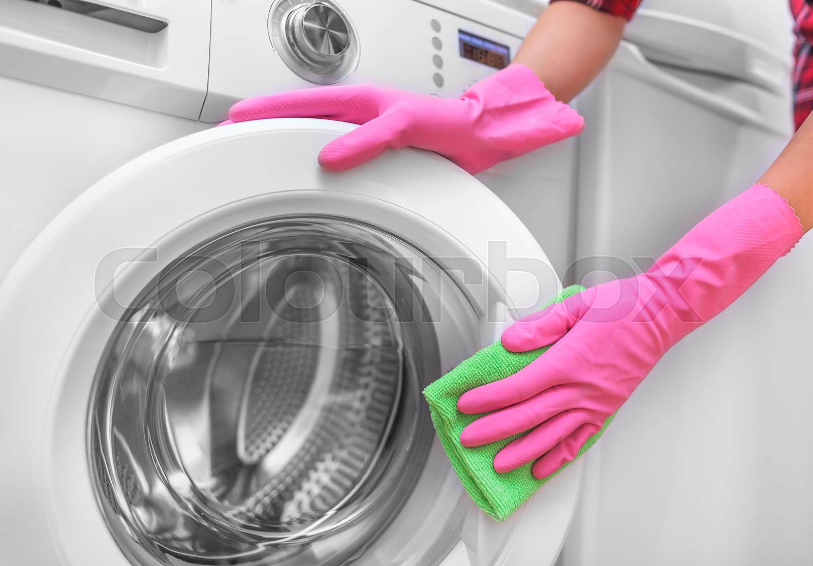Female hand wash washing machine. | Stock image | Colourbox