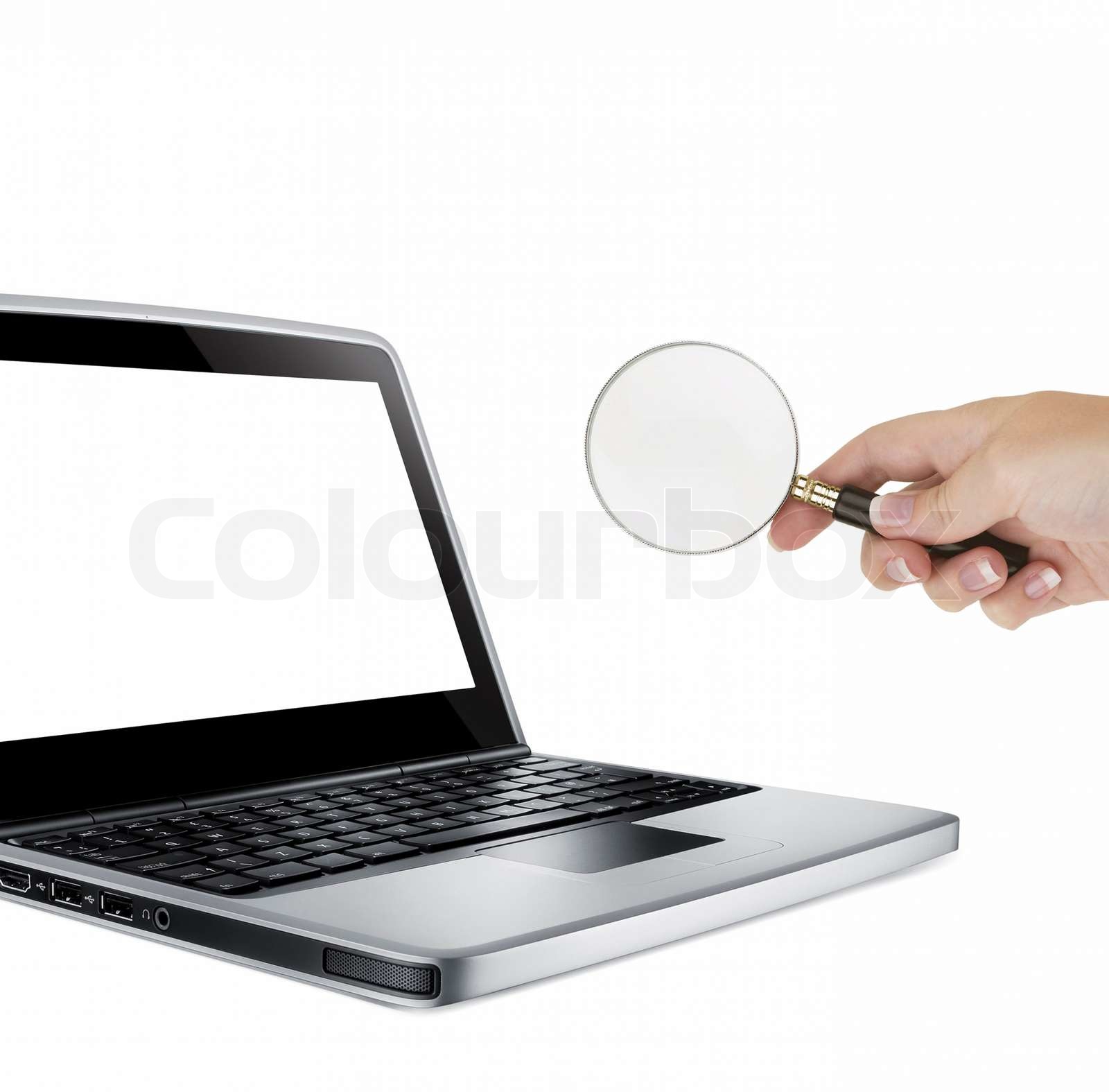 Laptop with a magnify glass | Stock image | Colourbox