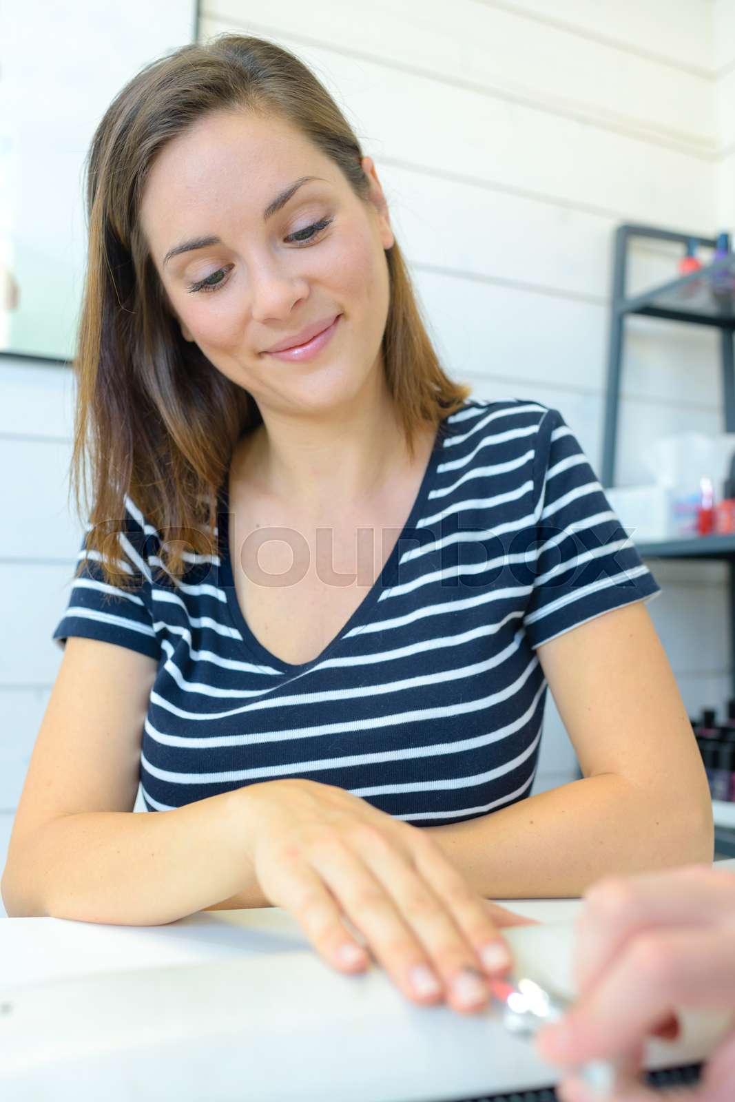 Lady having nails painted | Stock image | Colourbox