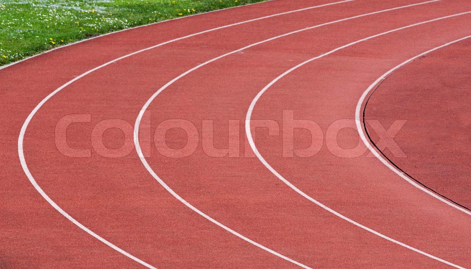 Curve of a running tracks on stadium | Stock image | Colourbox