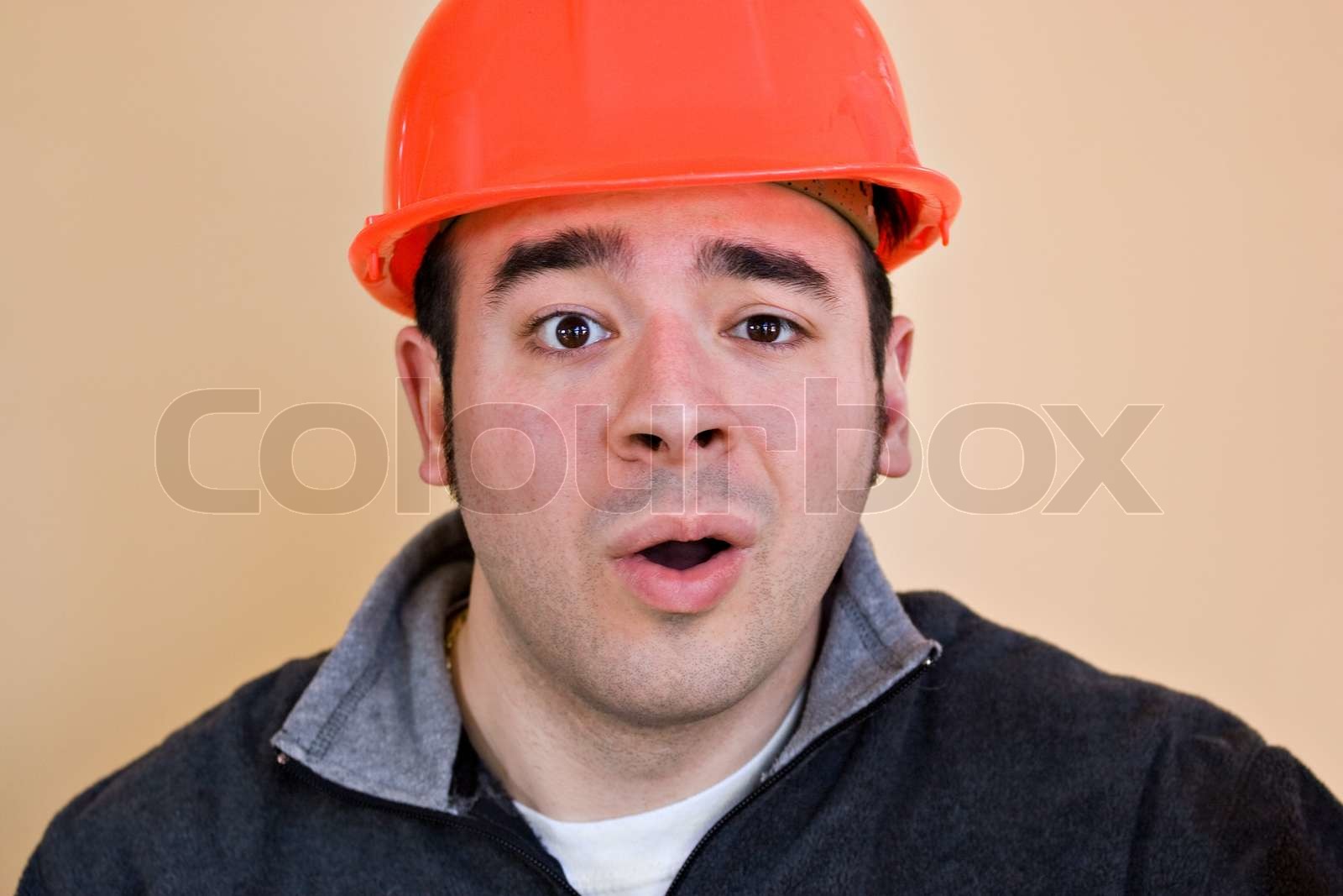 This construction worker is looking very confused | Stock image | Colourbox
