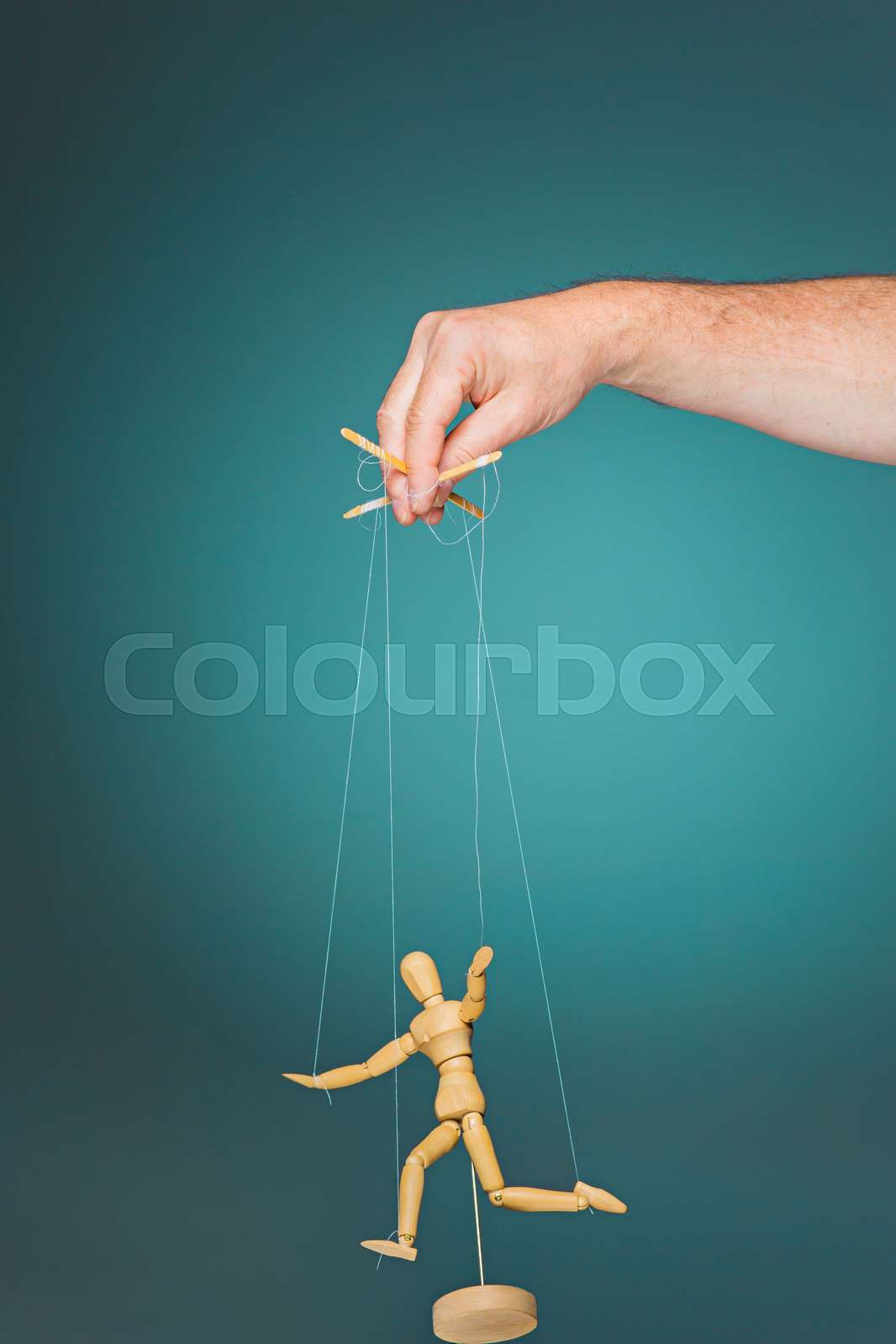 Image puppet in the hands of the puppeteer | Stock image | Colourbox