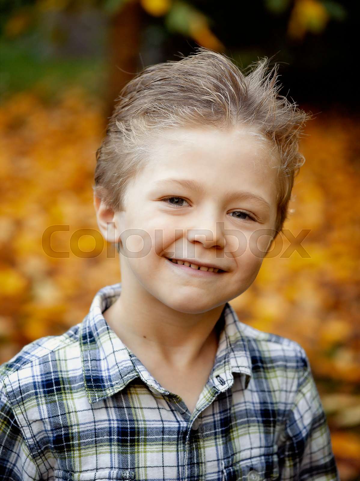 Cute boy smiling outdoor | Stock image | Colourbox