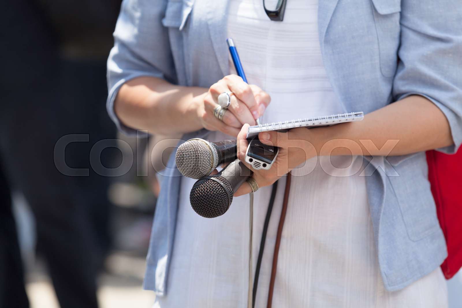 Female reporter at press conference | Stock image | Colourbox