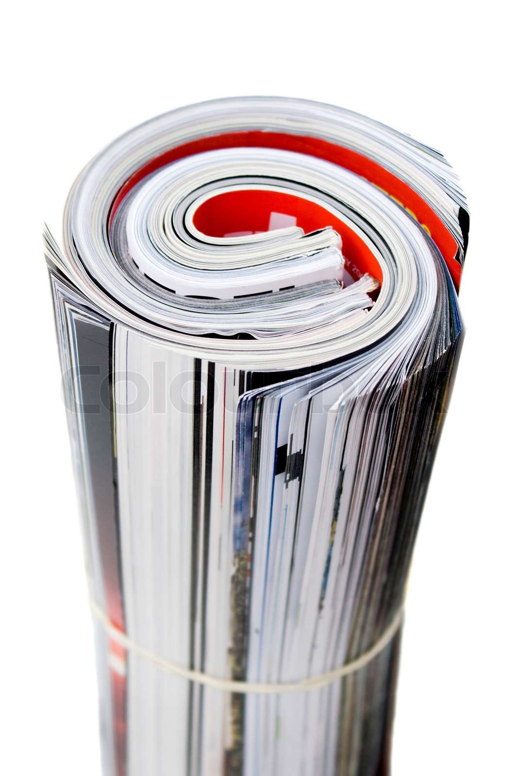 Rolled up magazines isolated over white Shallow depth of field | Stock ...