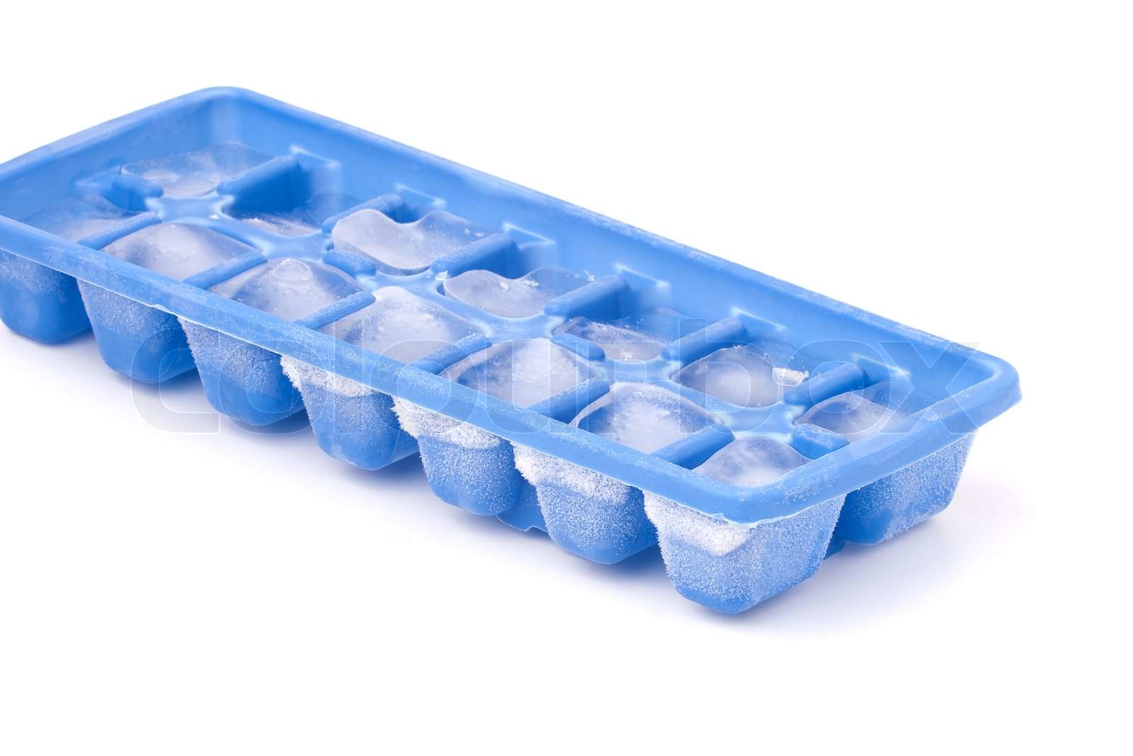 A blue plastic ice cube tray with frost on it isolated over a white ...