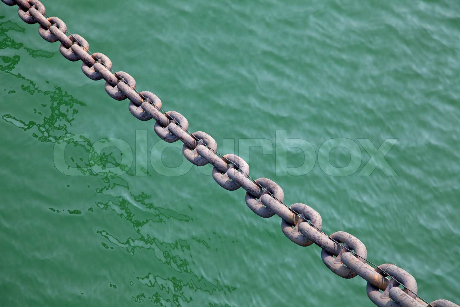 Huge old rusty anchor chain of the battleship | Stock image | Colourbox