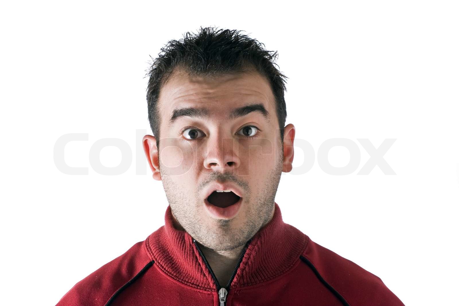 A shocked or surprised young man isolated over white | Stock image ...