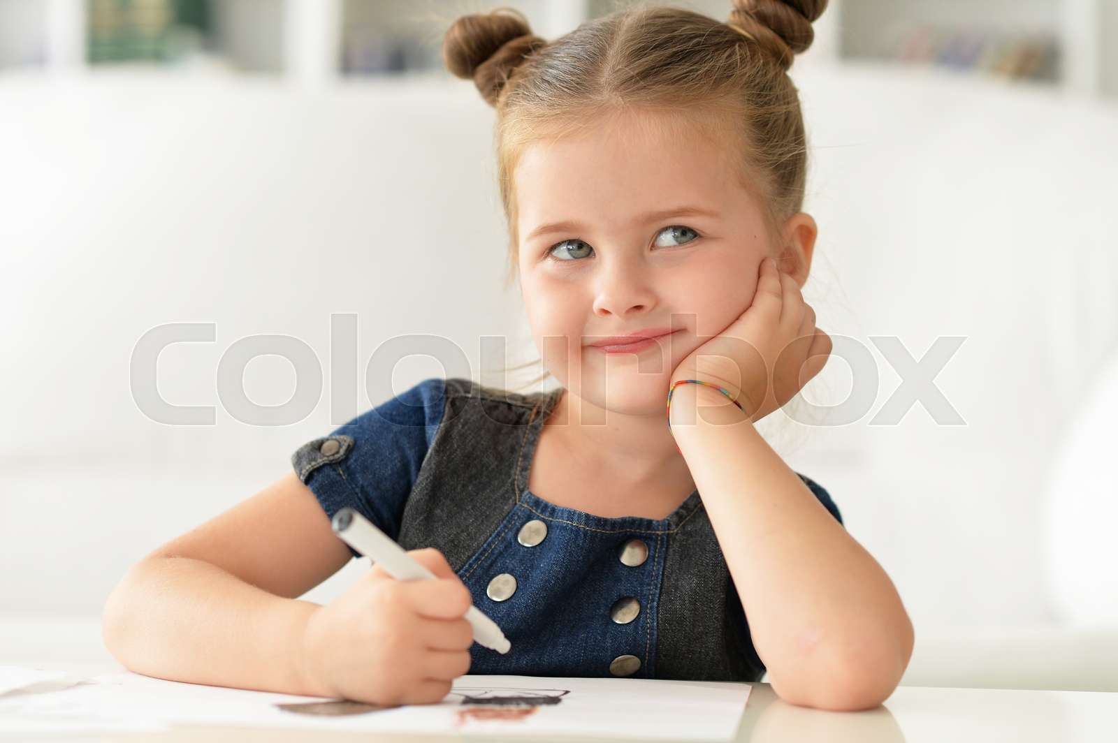 cute little girl thinking about something | Stock image | Colourbox