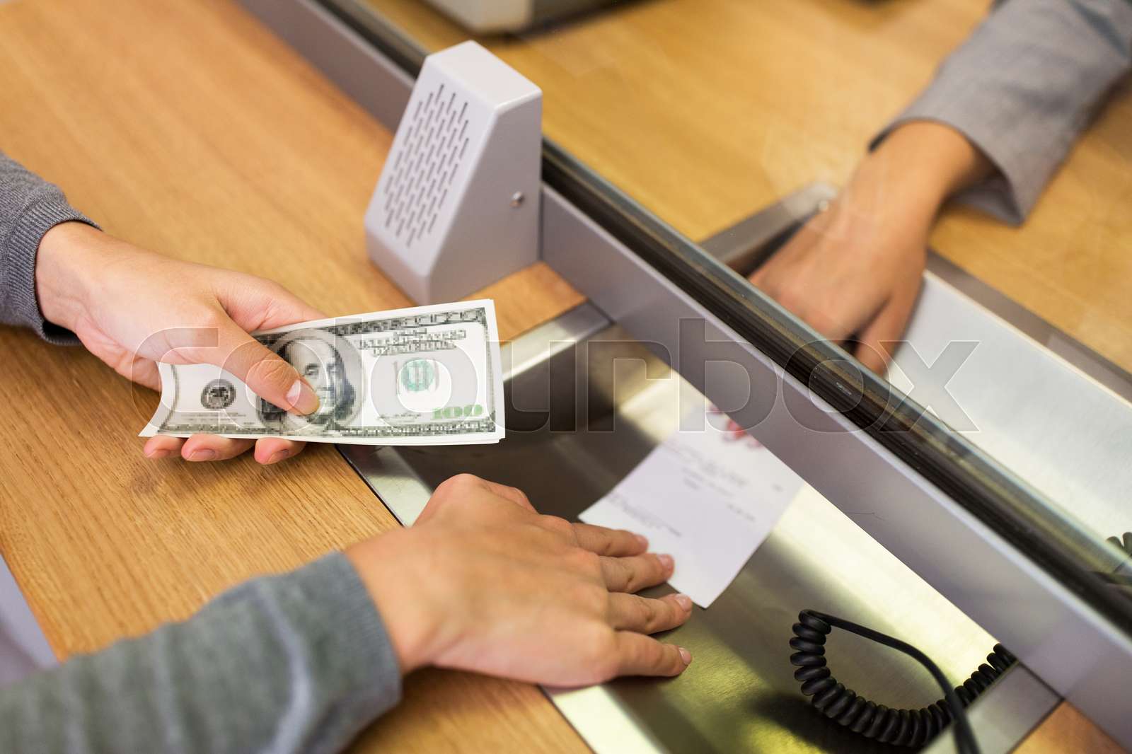 customer with money taking receipt from bank clerk | Stock image ...