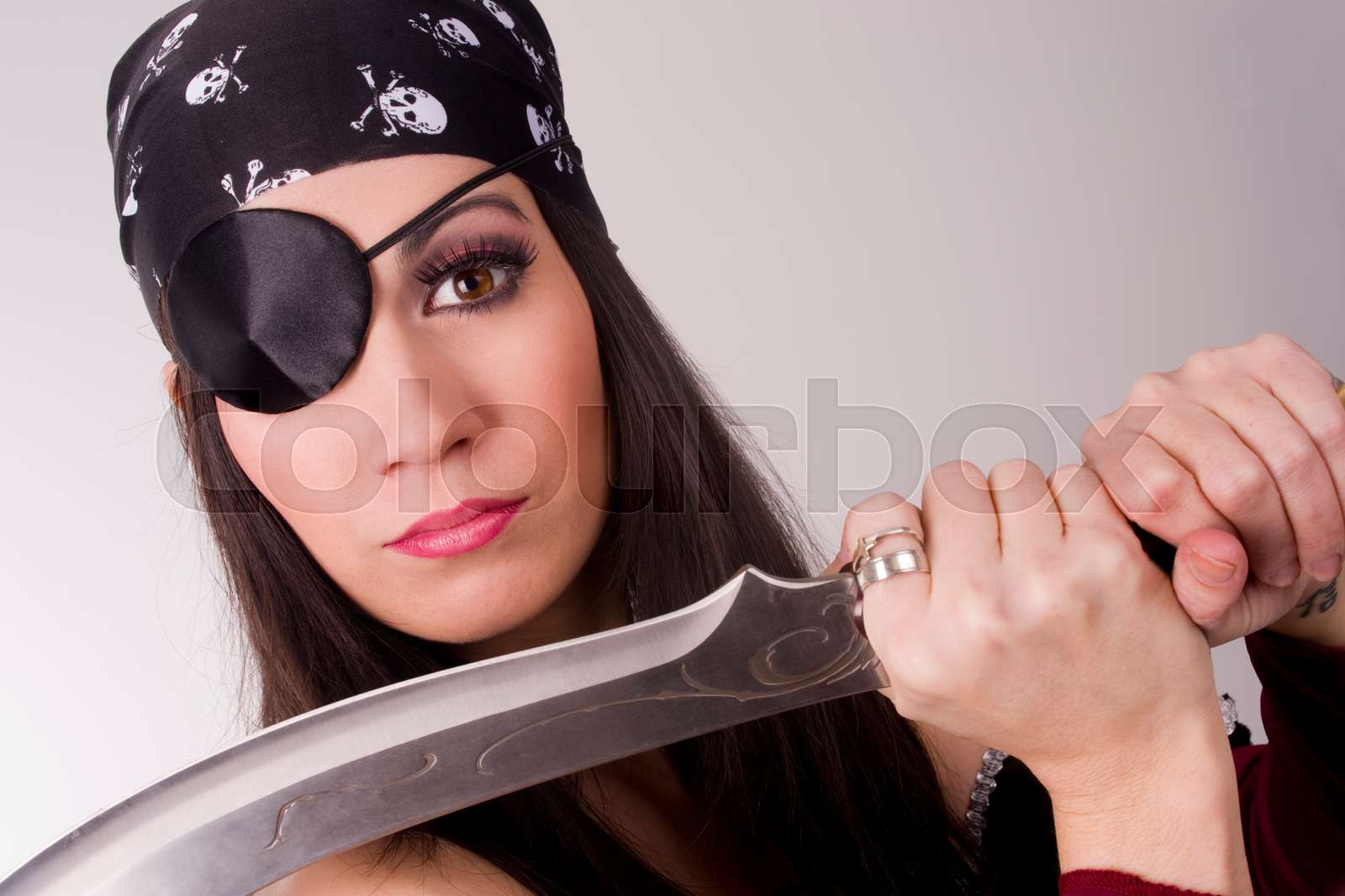 One Eyed Pirate Wench Woman Showing Knife Blade | Stock image | Colourbox