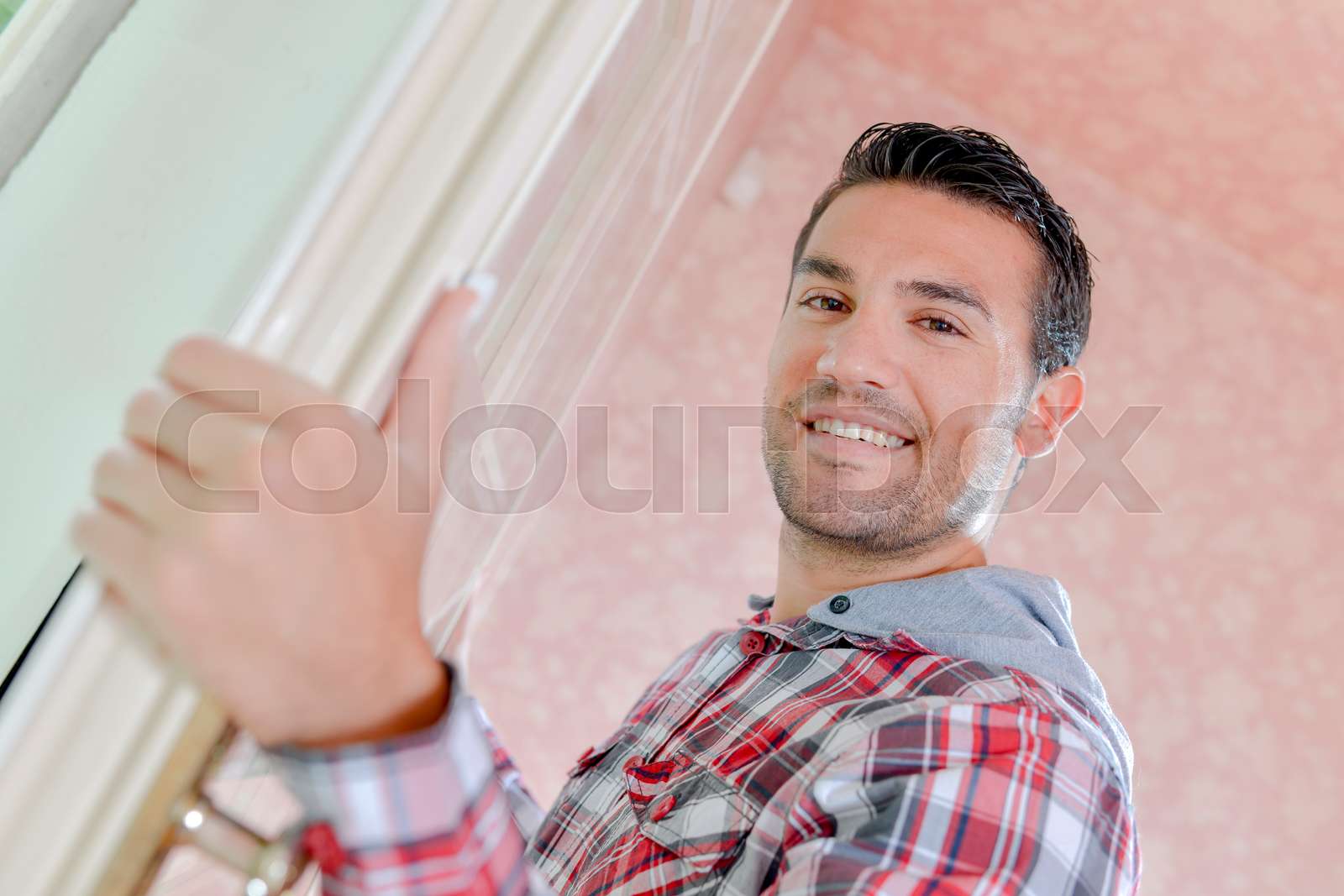 Man holding window | Stock image | Colourbox