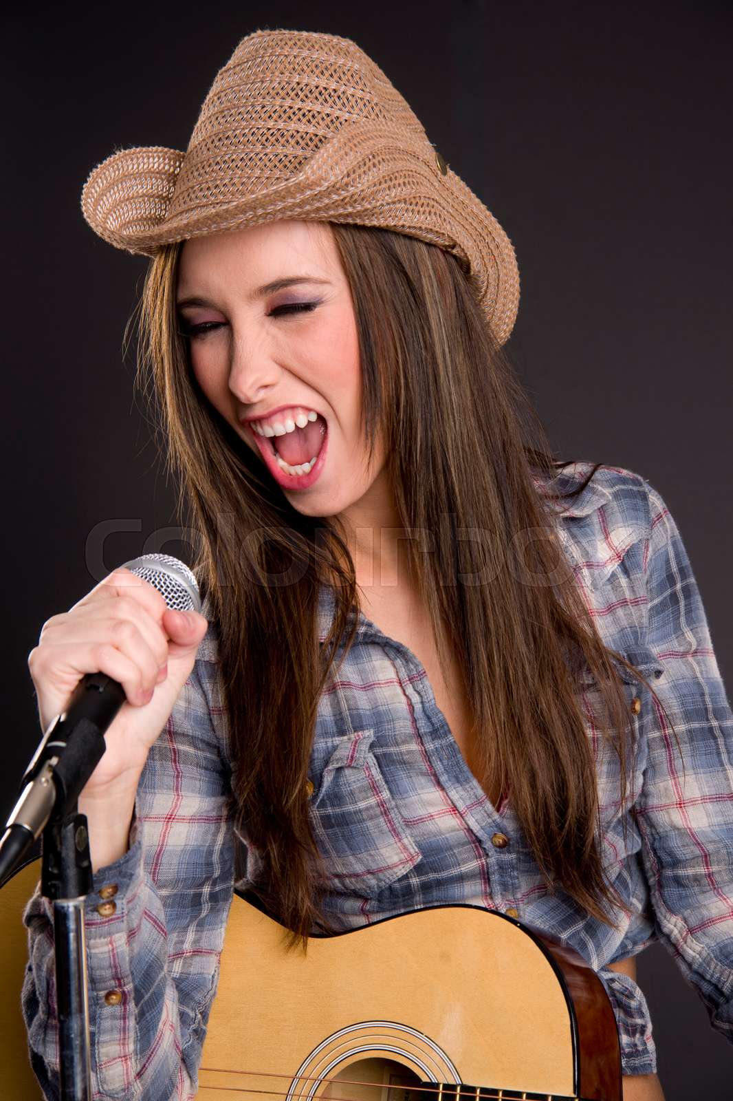 Cowgirl Singer Belts out Tune Yelling Singing into Microphone | Stock ...