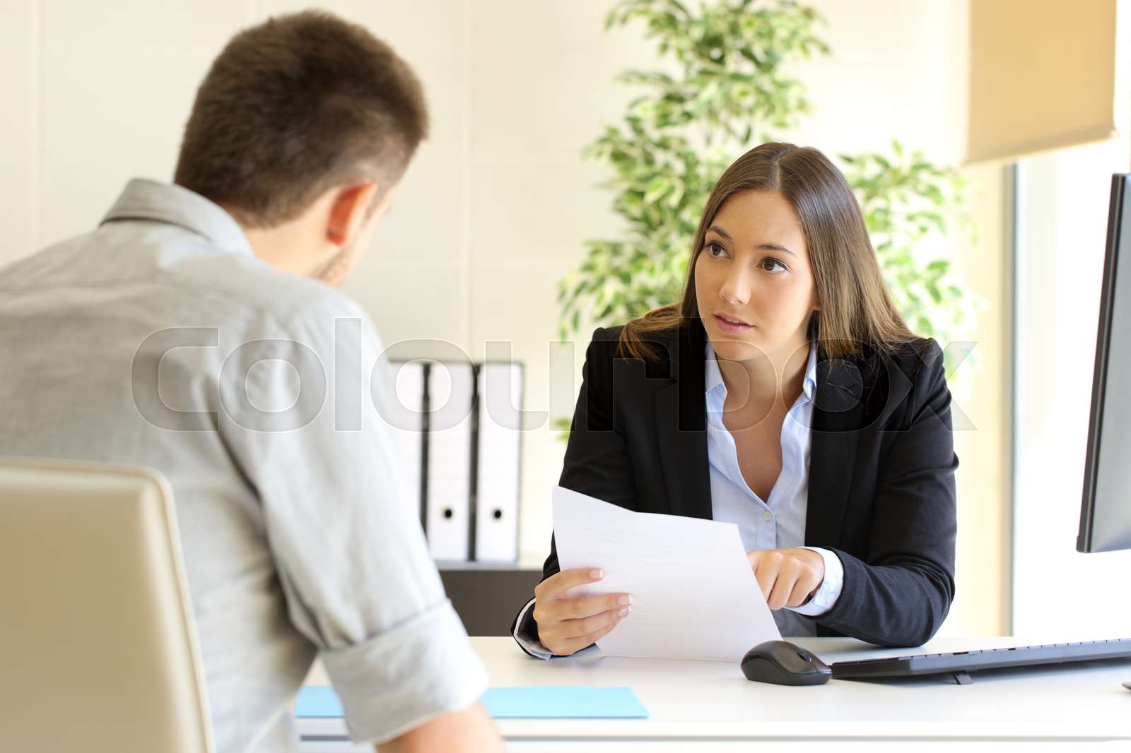 Man searching job during an interview | Stock image | Colourbox